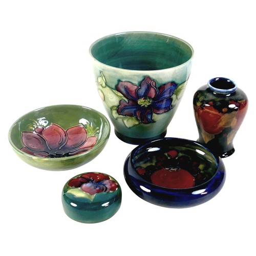 A group of five pieces of Moorcroft pottery including two small dishes ...