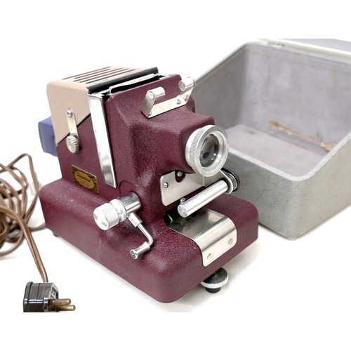 A collection of vintage cameras and camera equipment including a ...