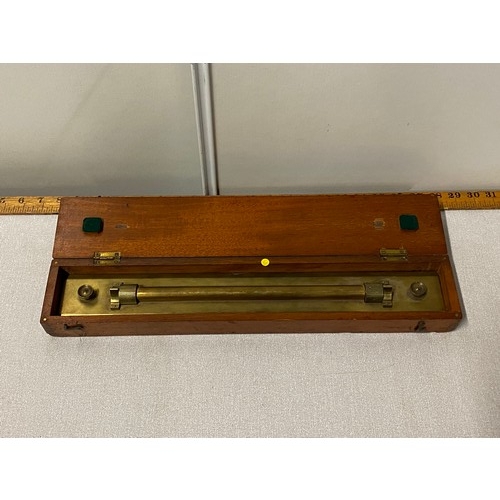 Vintage brass measuring tool in original wooden case.