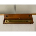 Vintage brass measuring tool in original wooden case.