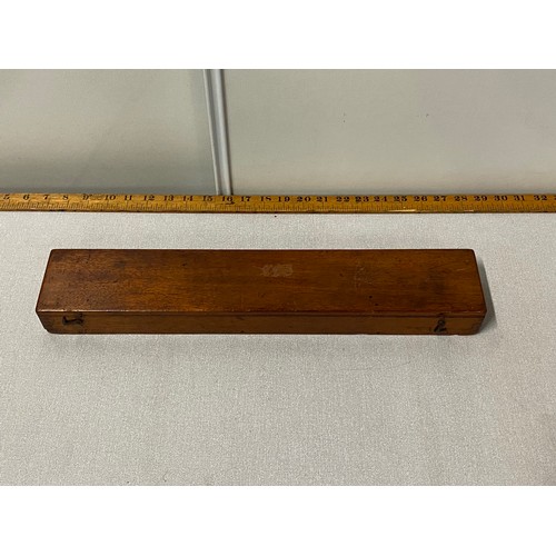Vintage brass measuring tool in original wooden case.