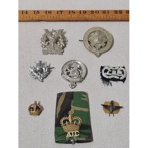collection of 8 military cap badges
