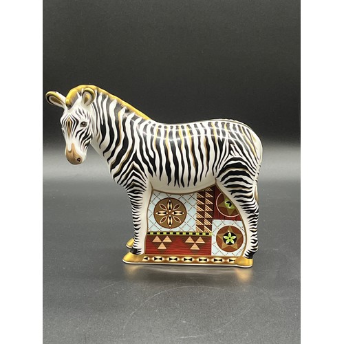 Royal Crown Derby adult zebra paperweight with gold stopper.