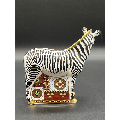 Royal Crown Derby adult zebra paperweight with gold stopper.