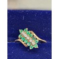 10k gold diamond & emerald waterfall ring.