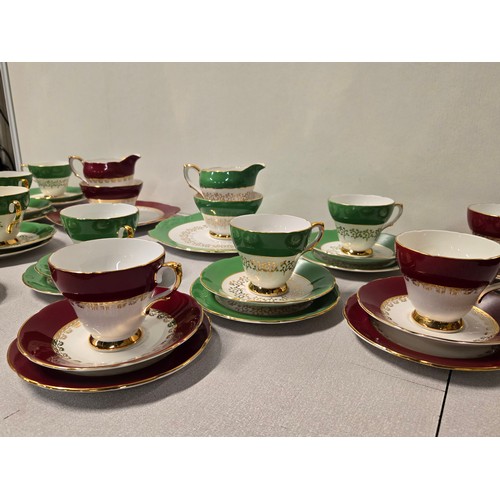 2, 21 piece fine bone China Royal Sutherland tea sets in green & red.