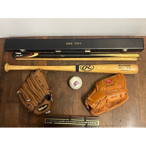 Selection of sporting items to include baseball bat and mitts, pool cue ...