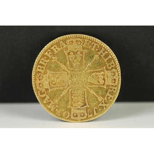 A British King William III 1701 gold full guinea coin.