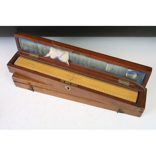 A collection of early to mid 20th century boxwood rulers together with ...