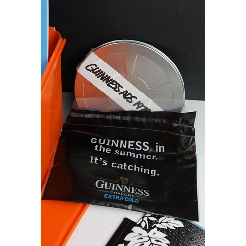 A mixed group of Guinness collectables to include badges, beer mats ...