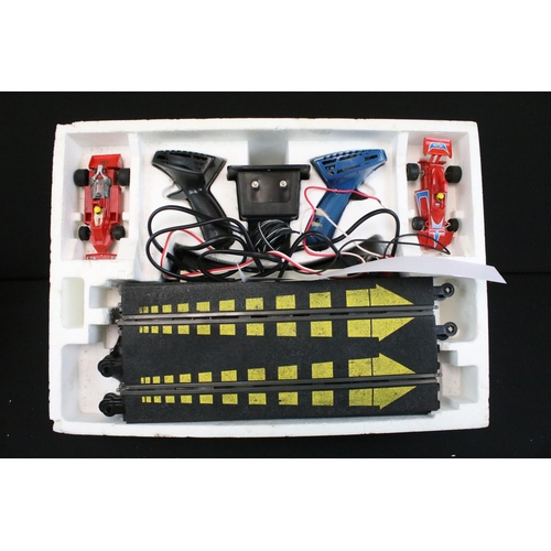 Collection of various Scalextric slot car racing related items to ...