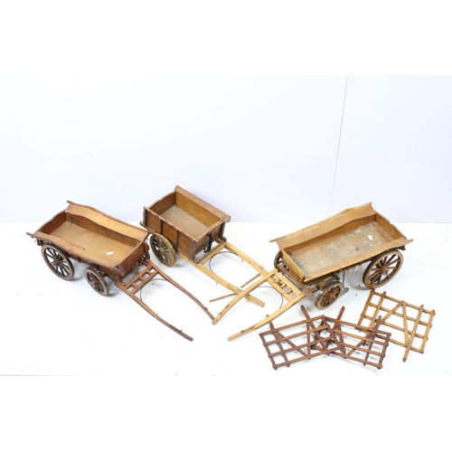 Three scratch built wooden cart models, largest approximately 35cm in ...
