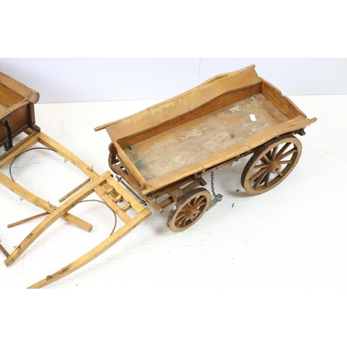 Three scratch built wooden cart models, largest approximately 35cm in ...