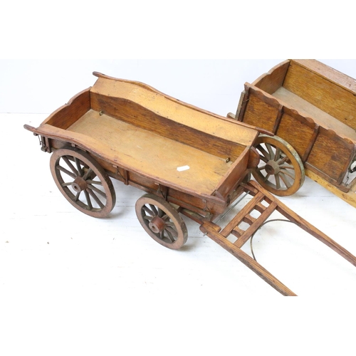 Three scratch built wooden cart models, largest approximately 35cm in ...