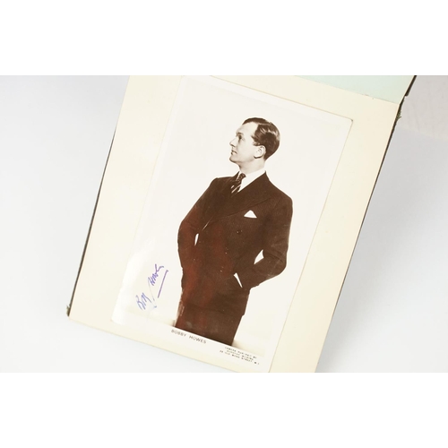 A vintage autograph book to include autographed photographs of John ...
