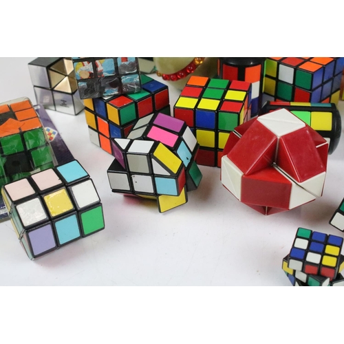 A collection of mixed Rubik's cube and puzzle cubes.