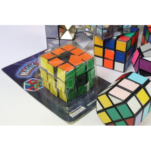 A collection of mixed Rubik's cube and puzzle cubes.