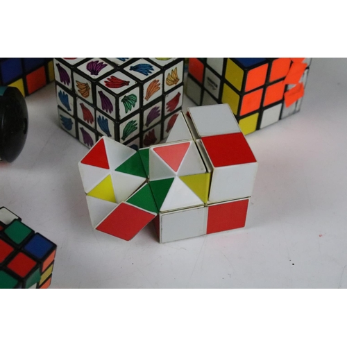 A collection of mixed Rubik's cube and puzzle cubes.
