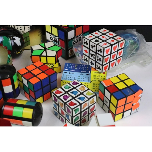 A collection of mixed Rubik's cube and puzzle cubes.