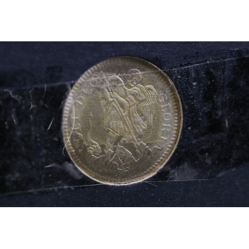 A 1974 gold Queen Anne touch piece coin within original issue case.