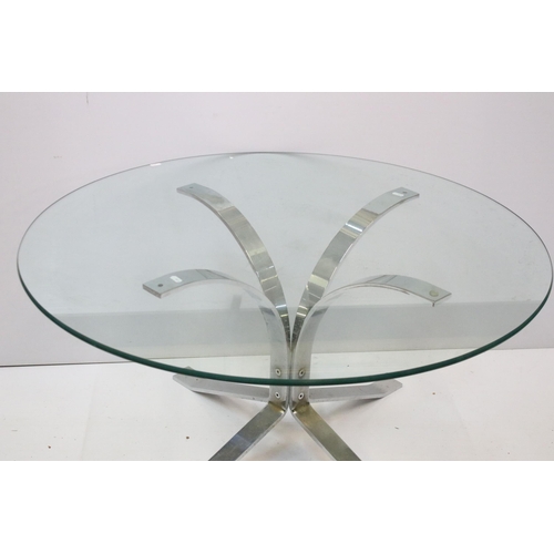 Vintage glass topped coffee table having a four point chrome base with ...