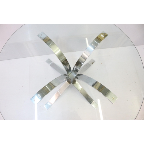 Vintage glass topped coffee table having a four point chrome base with ...