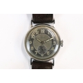 A 1940's French wristwatch with black dial, lumed hands and hour markers.