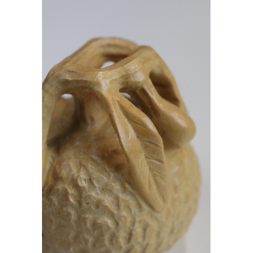 Two carved wooden netsuke figures of fruit