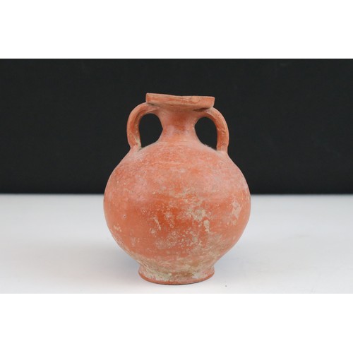 A 4th Century A.D. Roman redware globular twin handle vase / jar.