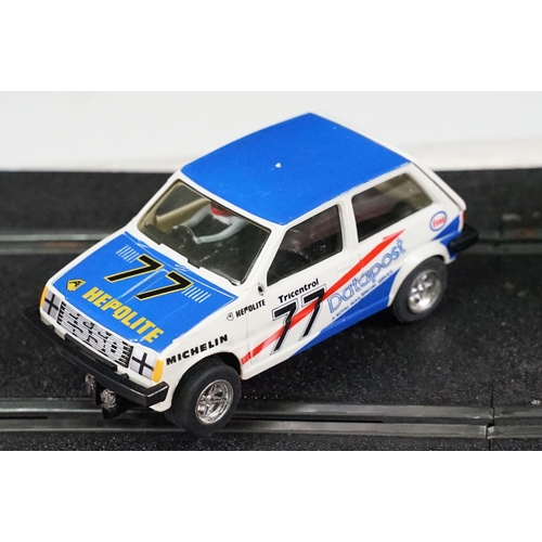 Three boxed Scalextric sets to include Batman Begins, Mighty Metro and ...