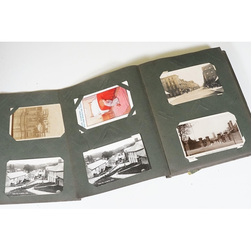 A collection of mainly early 20th century postcards both loose and within album to include printed a