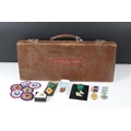 A collection of masonic jewels within a leather masonic case.