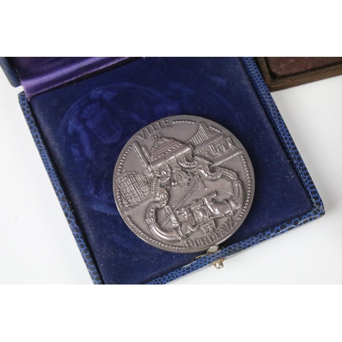 Five cased French medallions