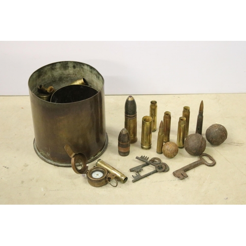 Collection of shell WWI shell cases and shell cartridges together with ...