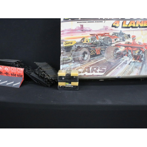 Boxed Scalextric 4 Lane set, together with a quantity of track ...
