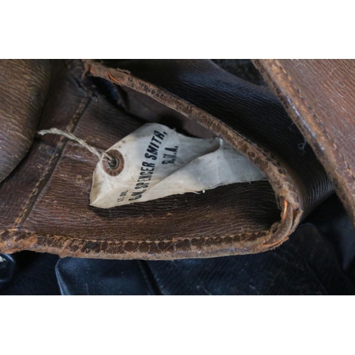 4 sword bags including a brown leather sword bag with a cloth label ...