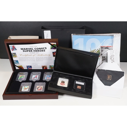 A collection of stamps to include the Marvel comic stamp set and ...