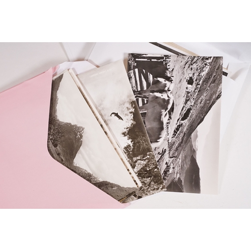 A large collection of mainly early 20th century postcards to include real photo, printed and silk ex