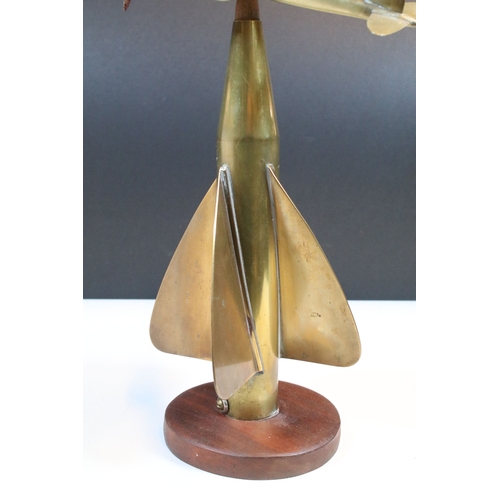Trench art sculpture formed of a shell casing body and topped with a ...