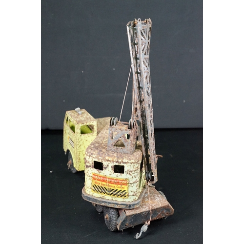 Four tinplate and metal toys to include Marx Toys Lumar Contractors ...