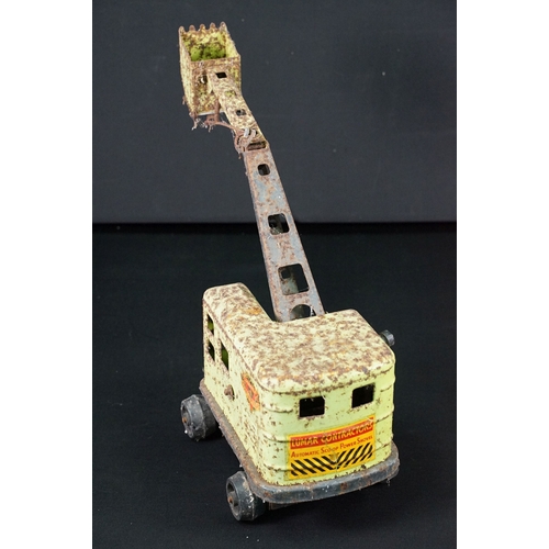 Four tinplate and metal toys to include Marx Toys Lumar Contractors ...