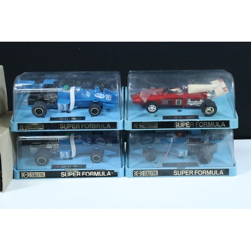 Eight cased Scalextric slot cars to include 3 x C121 Elf Tyrrell, 2 x ...
