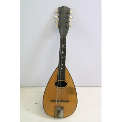 Eight string mandolin with mother of pearl detail, cased, with spare ...