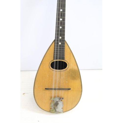 Eight string mandolin with mother of pearl detail, cased, with spare ...