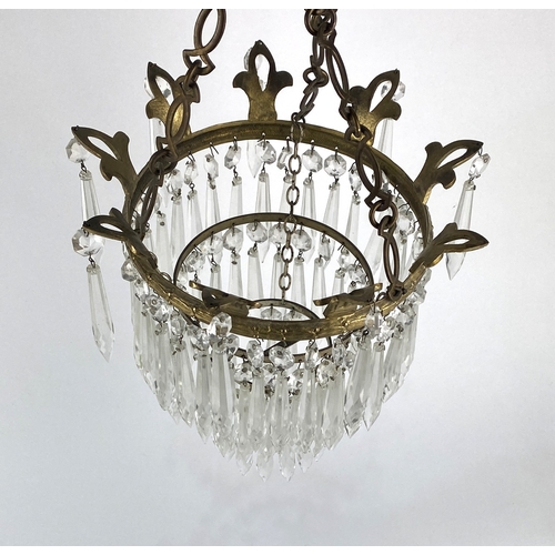A gilt metal and cut glass three tier circular light fitting with ...
