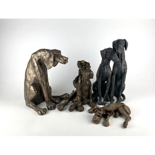 A collection of four various bronze effect dog figurines, to include ...