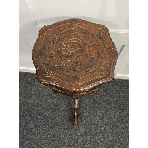 An Italian carved wooden torchere, c.1900, the column carved in the ...