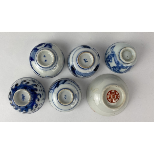 A group of six Japanese porcelain sake cups various designs to include ...