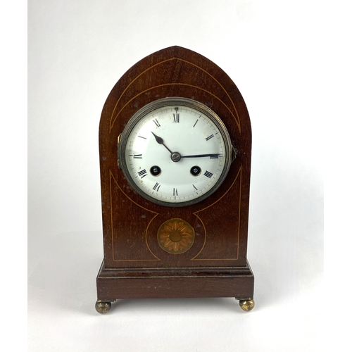 An early 20th century mahogany cased mantle clock, inlaid lancet shaped ...