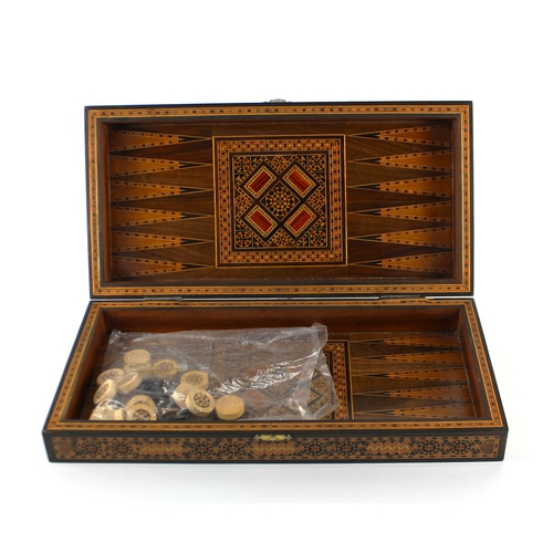 A vintage Damascus ware inlaid folding games box, outer chess board ...